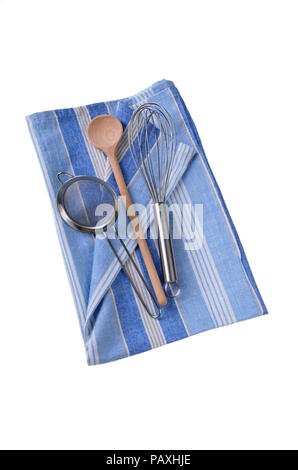 Whisk and tea towel on blue wooden background Stock Photo - Alamy