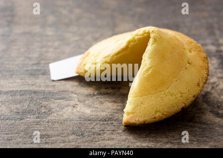 fortune cookies with a note on wooden table Stock Photo - Alamy