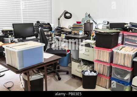 Busy, cluttered, home office table desk Stock Photo - Alamy