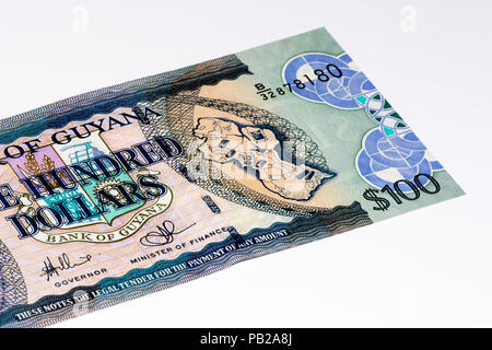 100 Guyanese dollars bank note. Guyanese dollar is the national ...