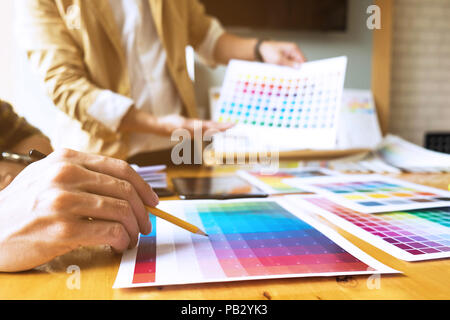 Graphic designers present colors from the color palette to their ...