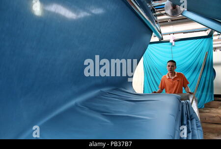 Nanton, Nanton, China. 26th July, 2018. Nantong, CHINA-Workers at a ...