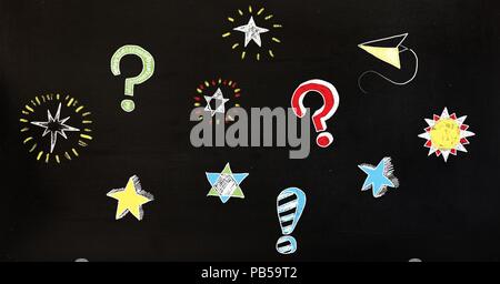 Stars and question marks on blackboard Stock Photo - Alamy