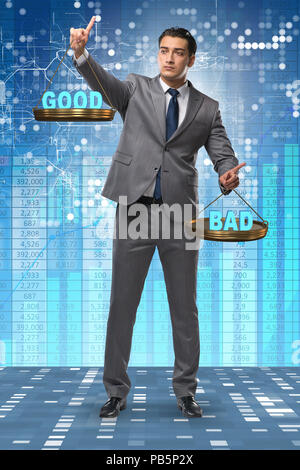 Businessman choosing between the good and bad Stock Photo - Alamy