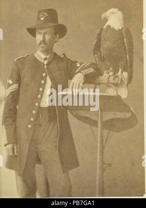An image of an unidentified Union Army sergeant seated while holding a ...
