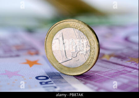 coin one euro at EUR 500 banknotes Stock Photo - Alamy