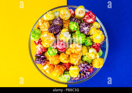 Sweet colored popcorn on bright background. Studio Photo Stock Photo ...