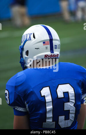 Male football player with his helmet art illustration silhouette on a ...