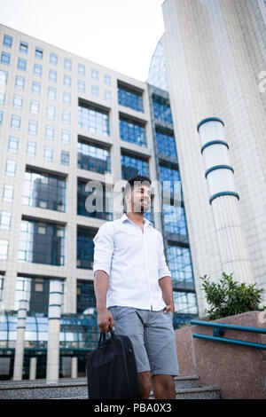 Young handsome business man with afro wearing glasses smiling crossing ...