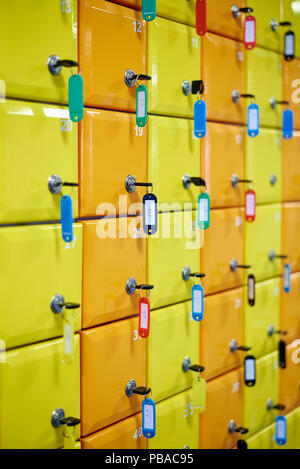 Series of colored, numbered lockers with locks, keys and tags Stock ...