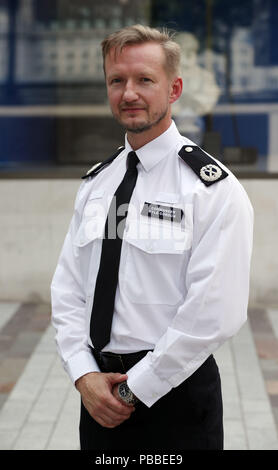 Commander Kyle Gordon speaking to the media outside New Scotland Yard ...