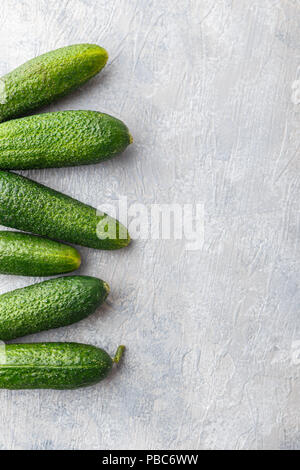 Fresh raw juicy cucumbers on a light background. Horizontal photo ...