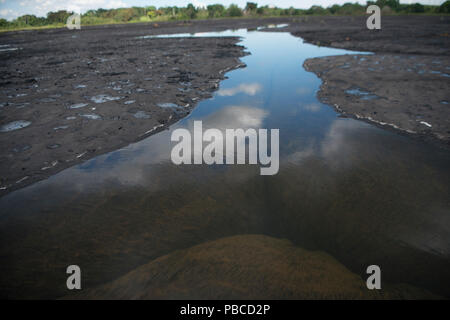 La Brea Pitch Lake, natural lake of tar rising from below with crust ...