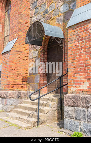 Closed iron gate in the facade of a palace with the inner yard behind ...