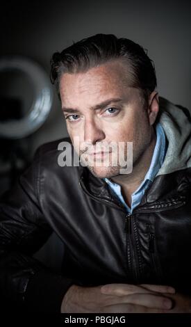 portrait of a handsome man in a leather jacket Stock Photo - Alamy