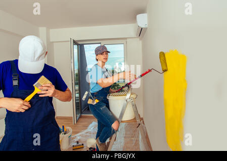 Couple renovate their living room from white to yellow with paint stick ...