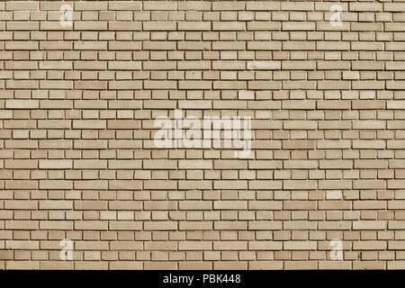 Almond Buff colored brick wall background Stock Photo - Alamy