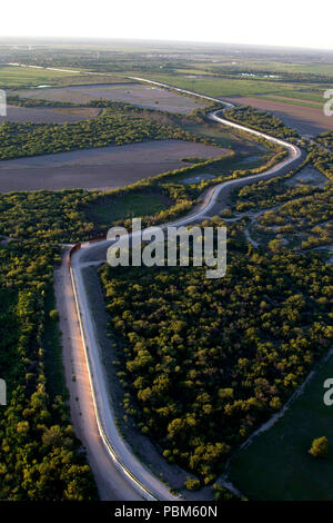 An aerial view of the South Texas McAllen fenceline in the Rio Grande ...