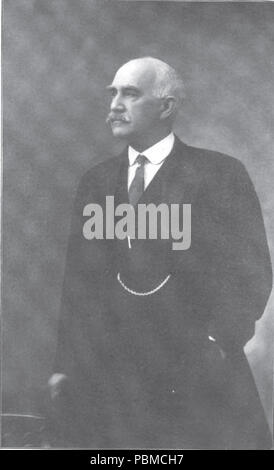 A portrait of Judson Harmon, a historical figure, seated at his desk ...