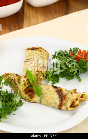 Crepe rolls filled with jam Stock Photo - Alamy