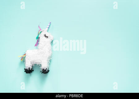 Small unicorn pinata for kids birthday party Stock Photo - Alamy