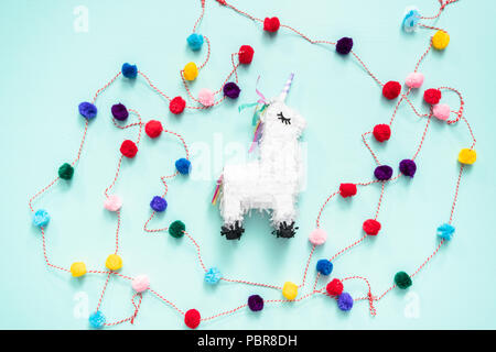 Small unicorn pinata for kids birthday party Stock Photo - Alamy