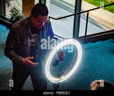 Photographer doing event portraits at art gallery opening Stock Photo ...