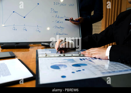 Businessmen present business plans and marketing to the partner ...