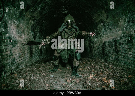 Post apocalyptic underground creature in gas mask Stock Photo - Alamy