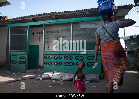 Monrovia, Liberia. 30th May, 2018. A man sifts through rubbish looking ...
