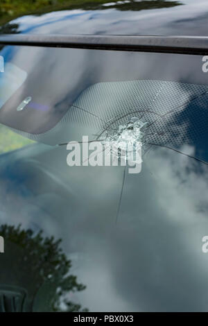 Cracked windscreen caused by a stone Stock Photo - Alamy