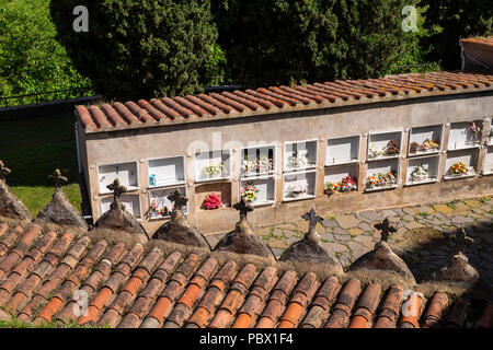 Cemetary with traditional wall burial plots in the medieval village of ...