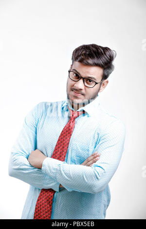 Young serious indian businessman using tablet computer while working ...