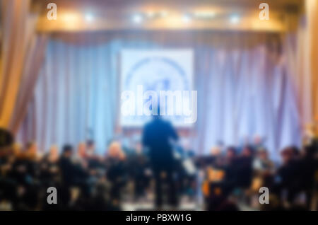 Orchestra conductor manages the orchestra. musical concept. blurred ...