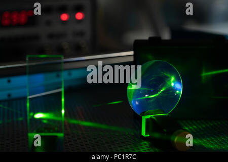 Green laser on optical table in a quantum optics lab Stock Photo - Alamy