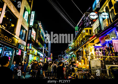 People visit Hongdae shopping street in Seoul South Korea. Hongdae is ...