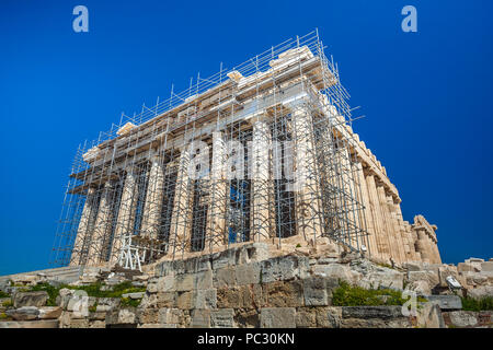 Restoration work in progress at world heritage ancient Parthenon with machine crane, scaffolding ...