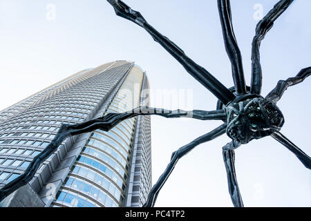 Tokyo, Japan - Dec 6, 2017: looking up view of Mori Building and spider ...