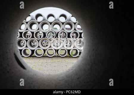 See-through with pile of concrete sewer pipes at concrete plant Stock ...