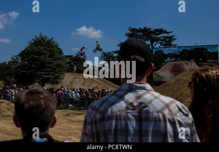 Motocross riders jumping a ramp Stock Photo - Alamy