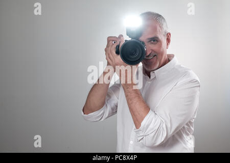 Studio shot of man against brown background Stock Photo - Alamy