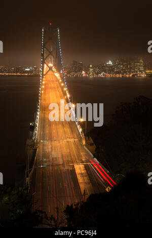 Elevated view of the Bay Bridge lit up at night, San Francisco, North ...