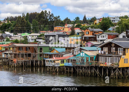 Palafitos, colourful stilt houses on water's edge, elevated view ...