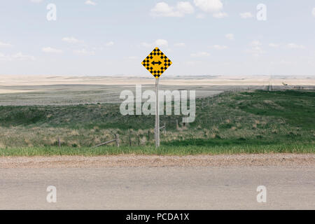 Arrow intersection sign and rural farmland Stock Photo - Alamy