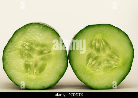 Sliced cucumbers isolated on white Stock Photo - Alamy