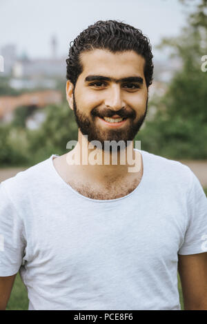Outdoor portrait of cheerful Syrian man Stock Photo - Alamy