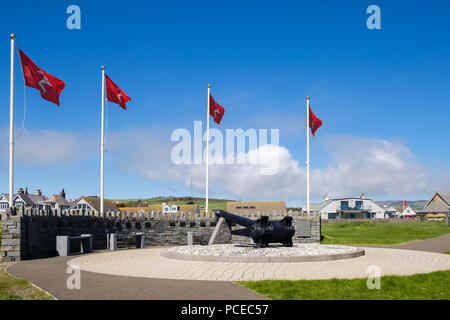 Manx flags flying at Dunkirk Memorial on coast at Kallow Point, Port St ...