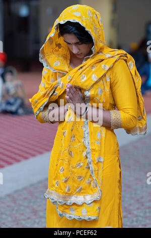 A Sikh woman prays and meditates in a temple in Richmond Hill, Queens ...