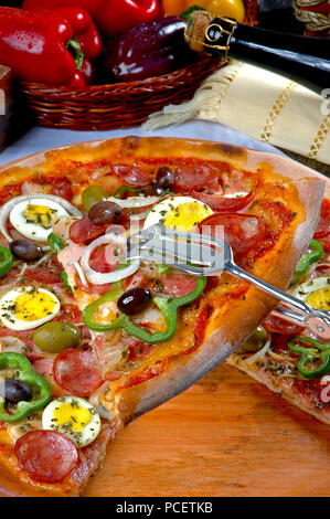 Portuguese Pizza, onion, peppers, pepperoni, egg, olive Stock Photo - Alamy