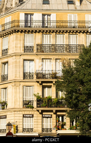 A typical Haussmann style building in Paris with balconies, arches ...
